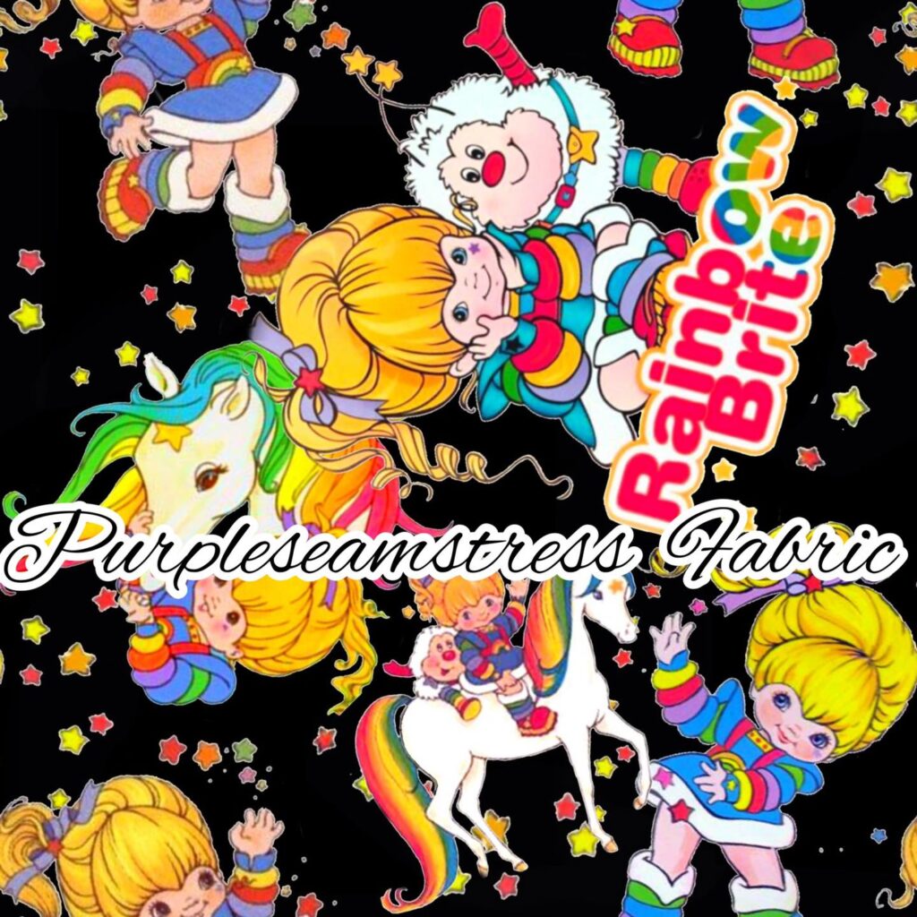 Rainbow Bright on Black – Fabric – Purpleseamstress Fabric